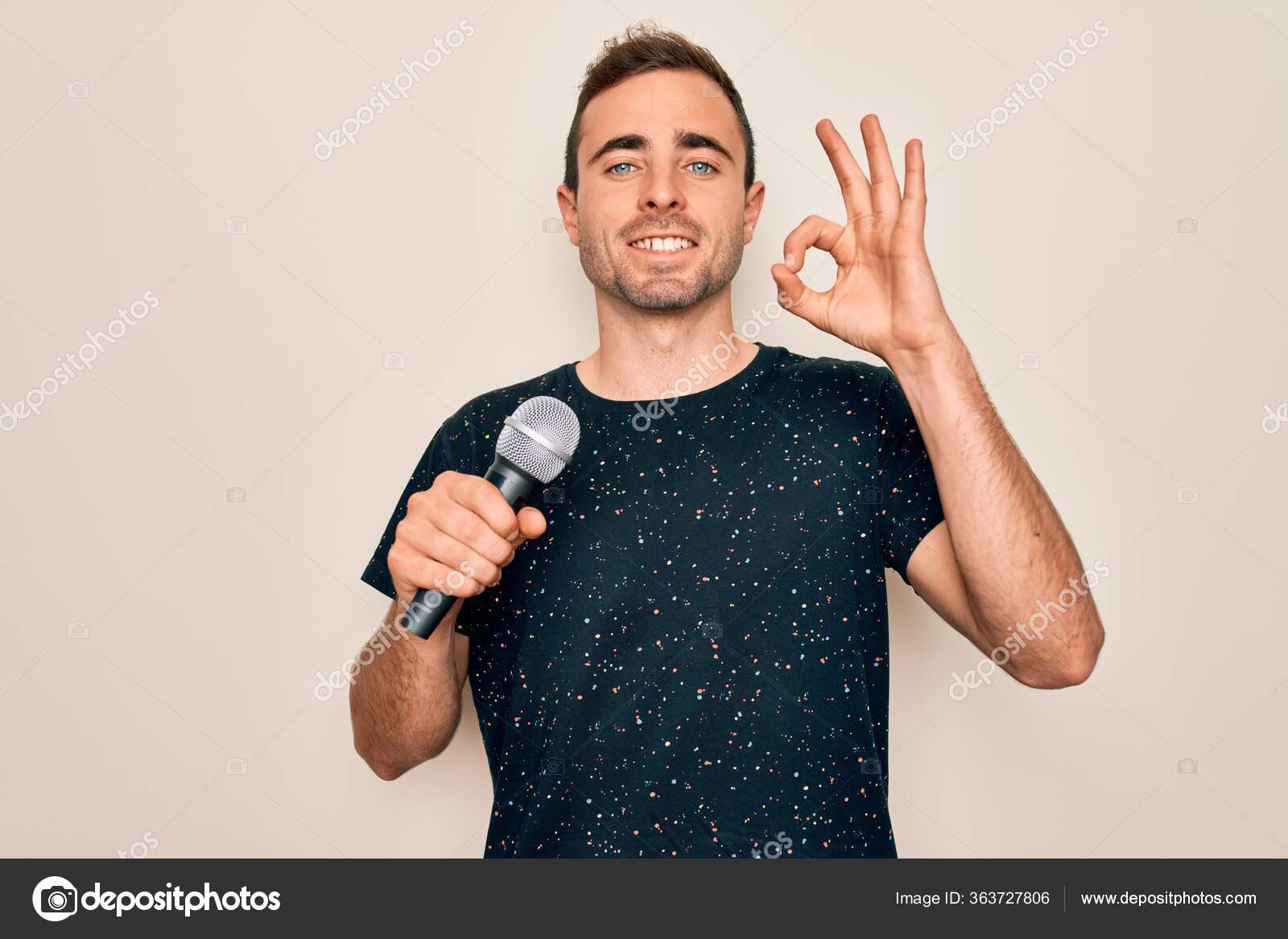 Young Handsome Singer Man Blue Eyes Singing Using Microphone White — Stock Photo © Krakenimages ...