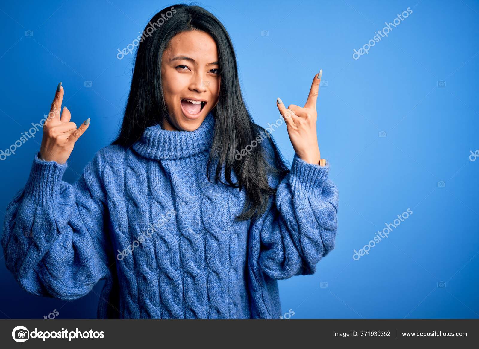 Young Beautiful Chinese Woman Wearing Casual Sweater Isolated Blue ...
