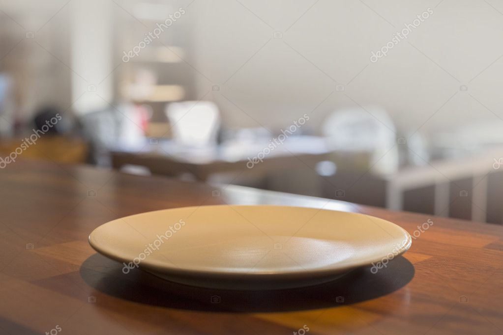 Plate on the kitchen table Stock Photo by ©kornienkoalex 127043734