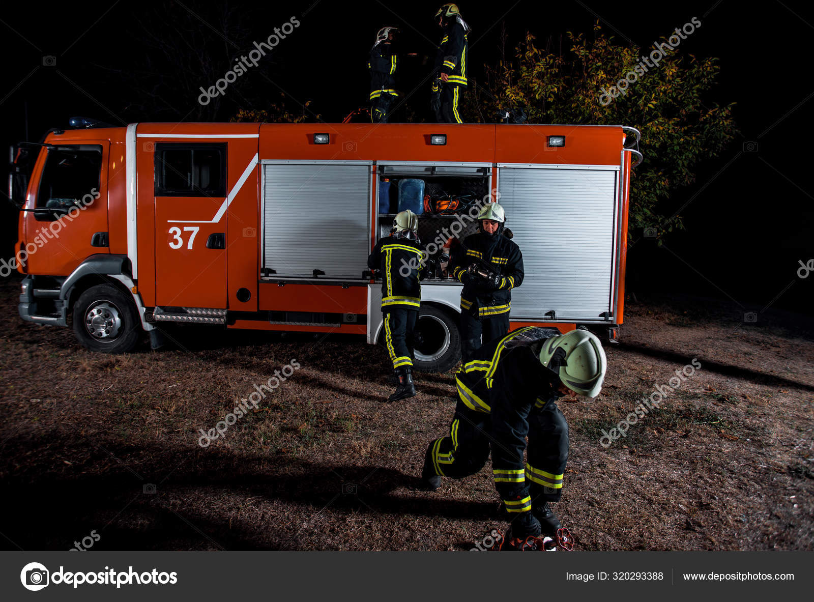 Fireman team during intervention Stock Photo by ©gorgev 320293388