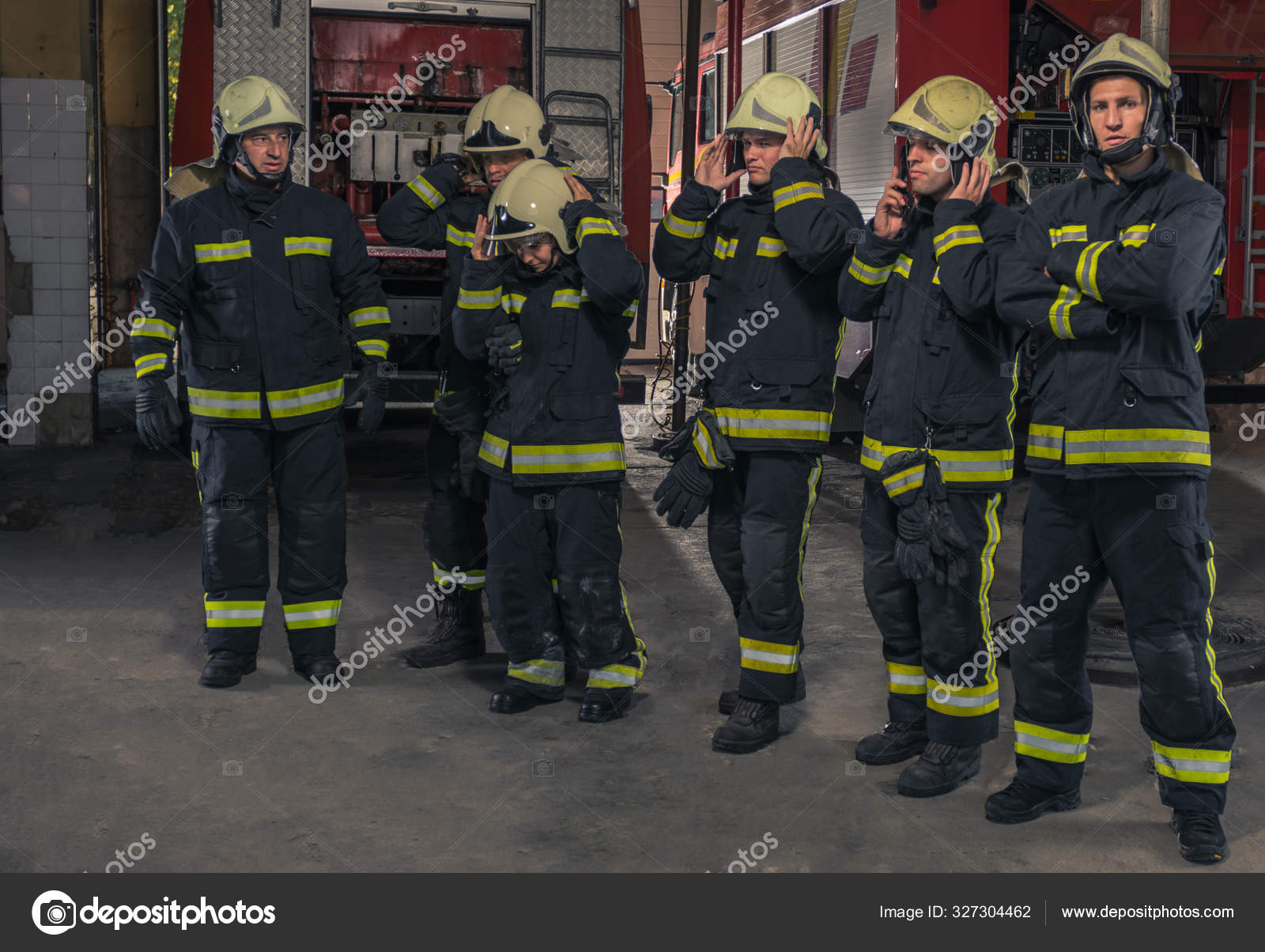 Group of firefighters standing confident with arms crossed. Fire ...