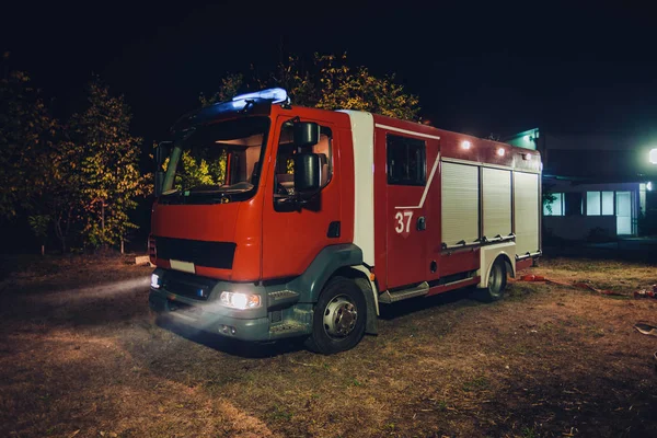 Firefighting vehicle responding to fire emergency situation - Stock ...