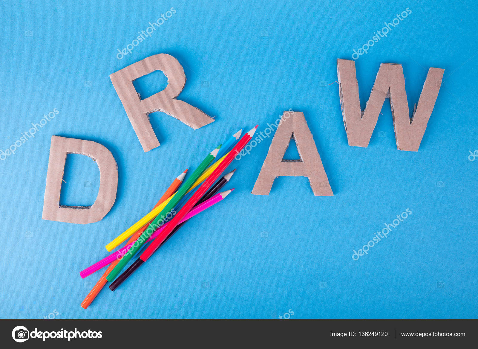 Word DRAW made from cardboard letters on a blue background made photo ...