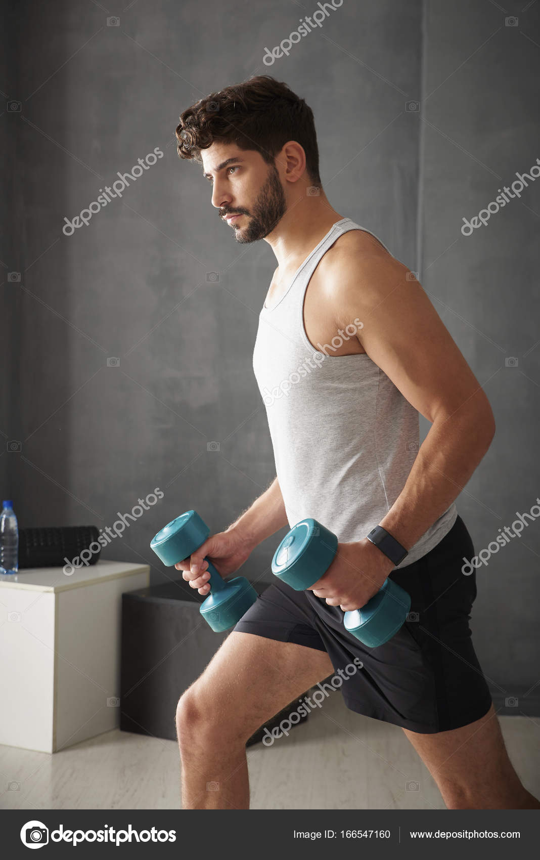 Man working out with weights in gym ⬇ Stock Photo, Image by © gzorgz ...