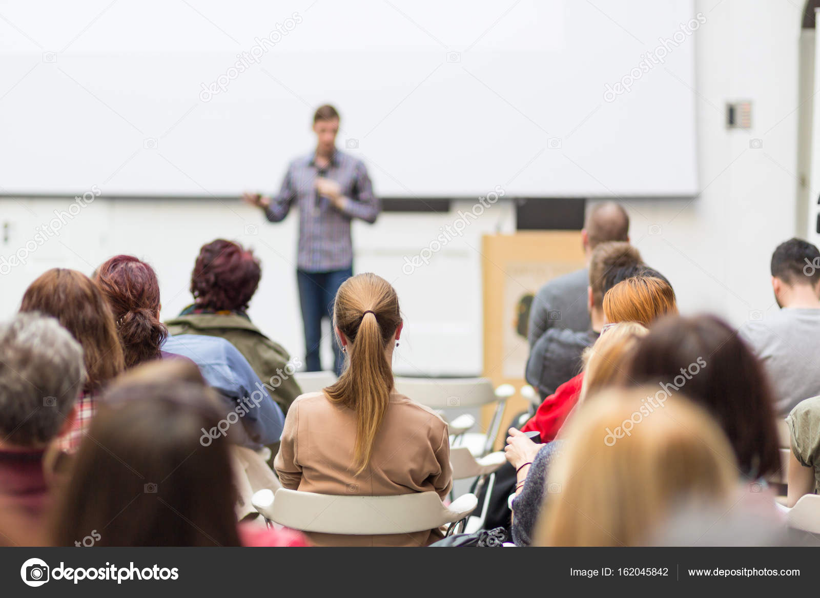 Man giving presentation in lecture hall at university. — Stock Photo ...