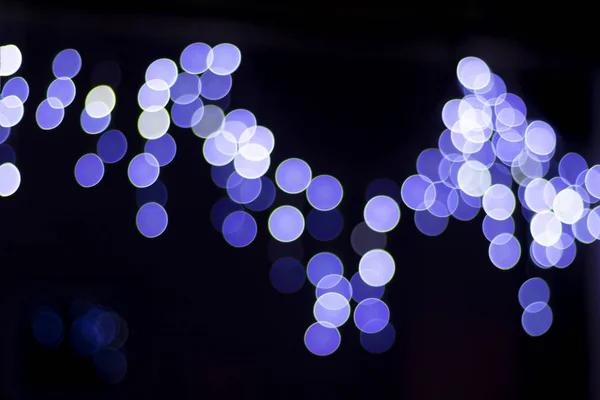 no focus, black background. lights, garland. single color. - Stock ...