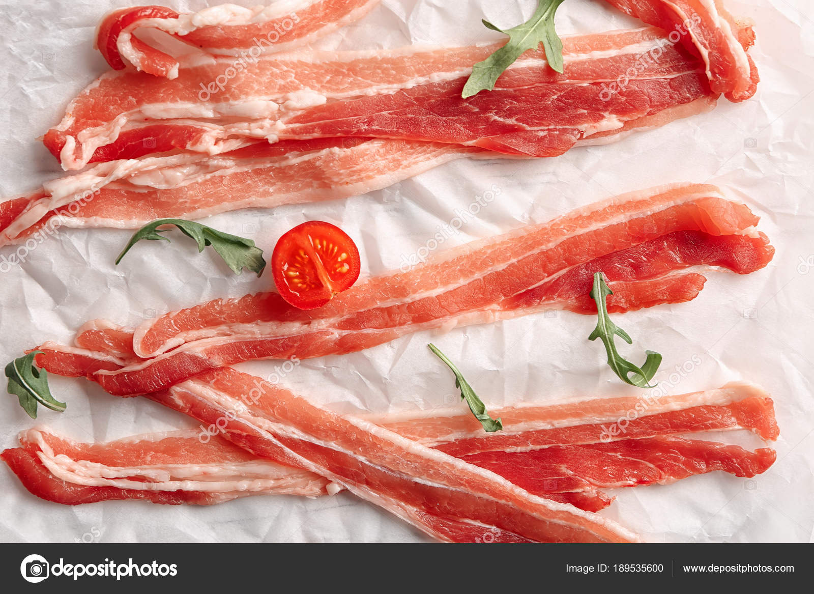 Rashers of bacon on parchment, closeup — Stock Photo © serezniy #189535600