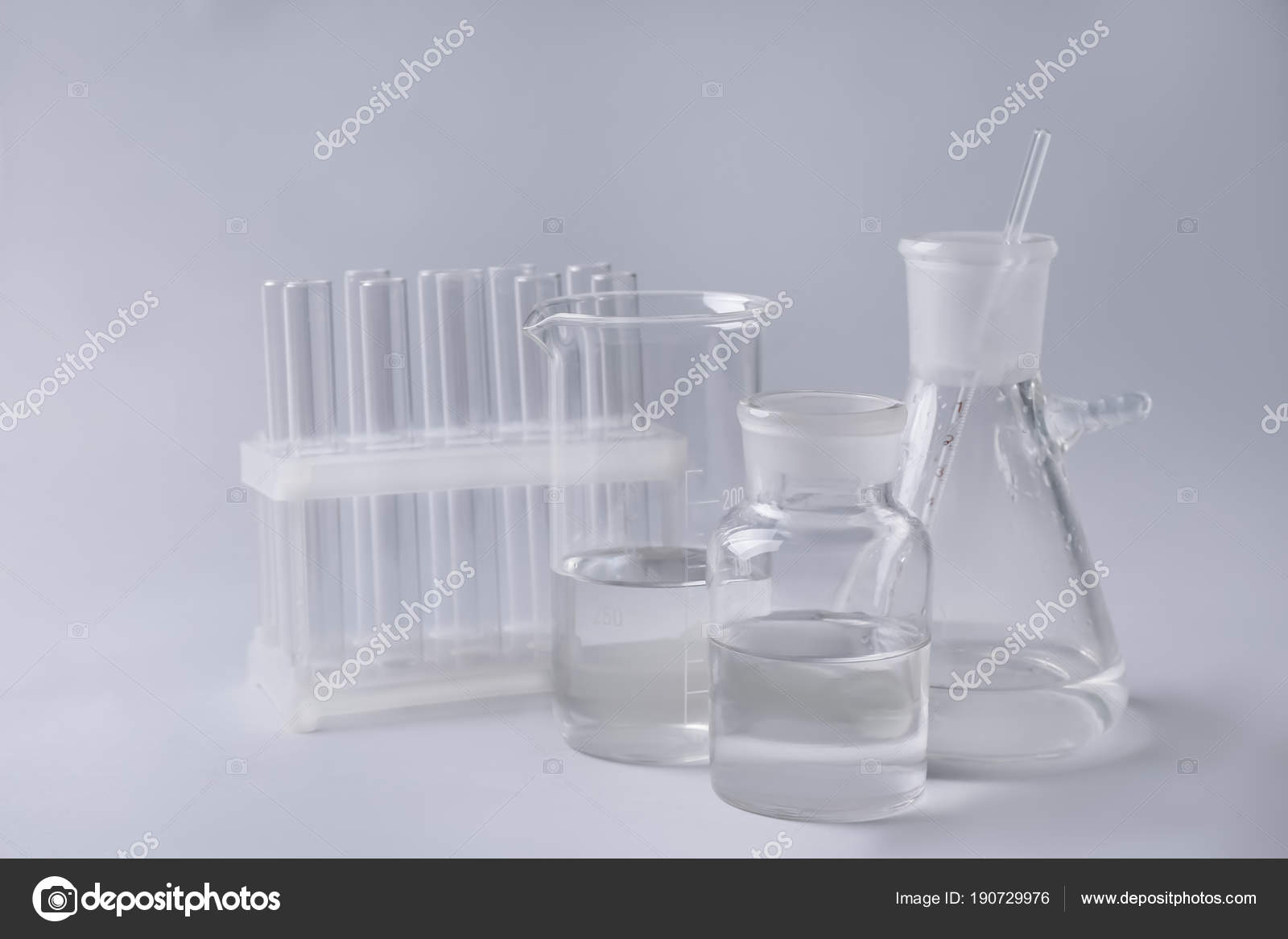 Different laboratory glassware on grey background — Stock Photo ...