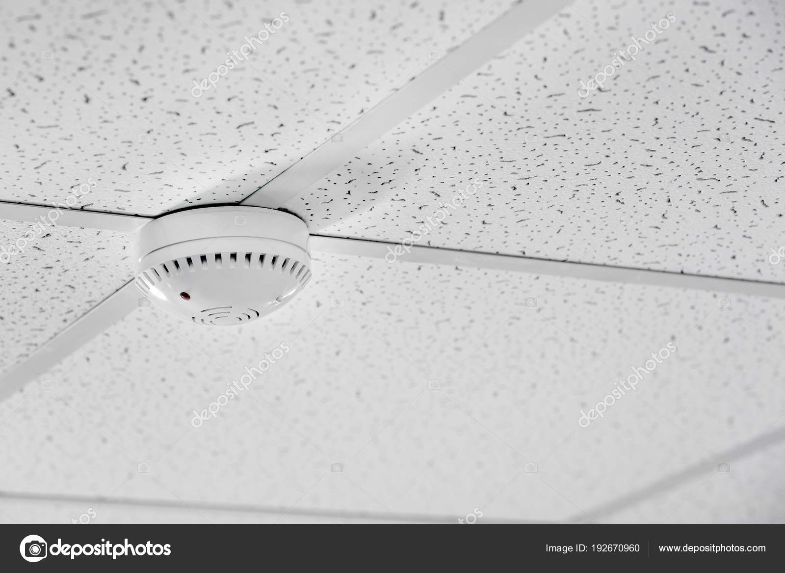 Modern smoke detector on ceiling indoors — Stock Photo © serezniy ...