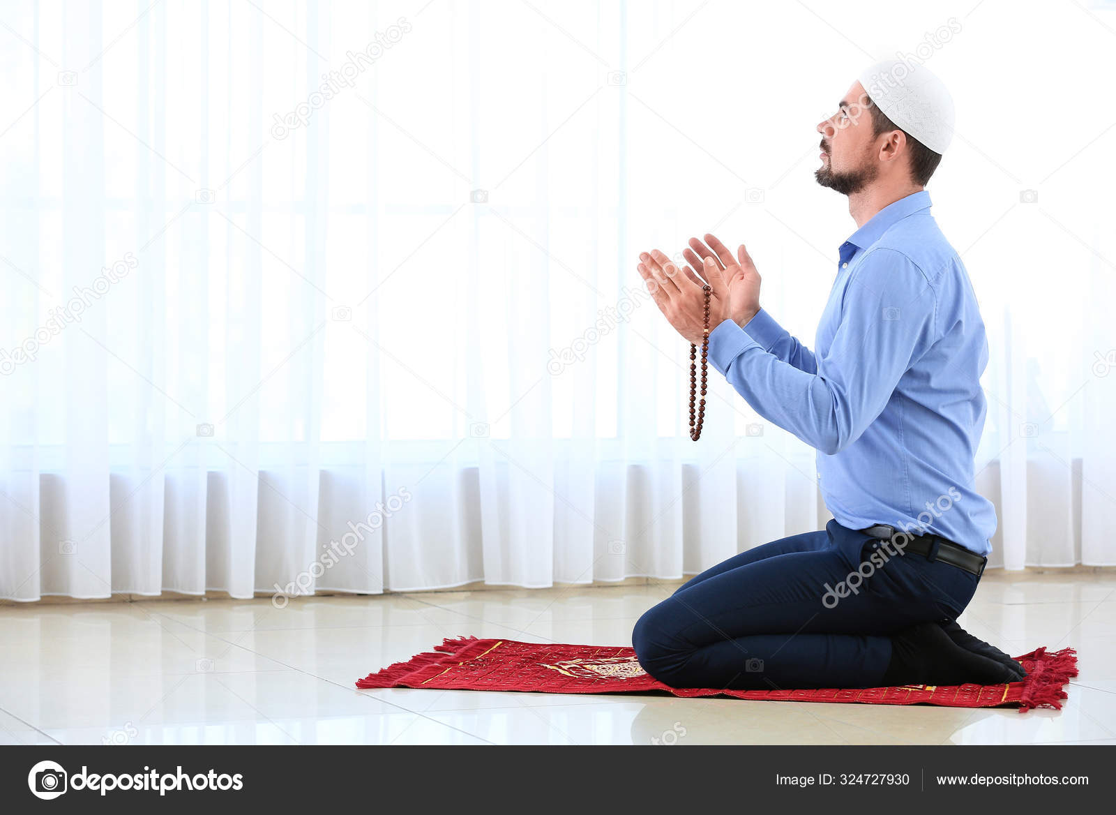 Muslim man praying in room — Stock Photo © serezniy #324727930
