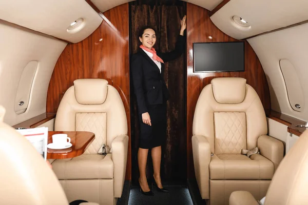 Air hostess on board the modern private airplane - Stock Image - Everypixel