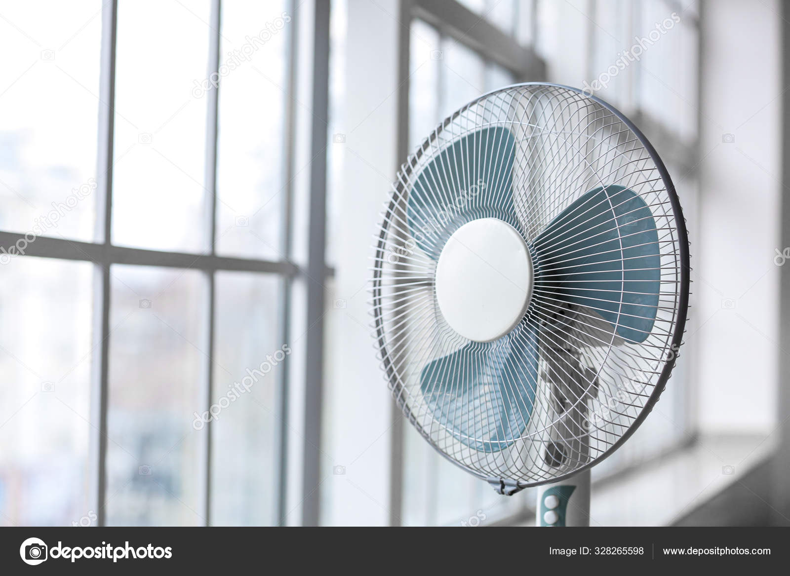 Electric fan near window in room Stock Photo by ©serezniy 328265598