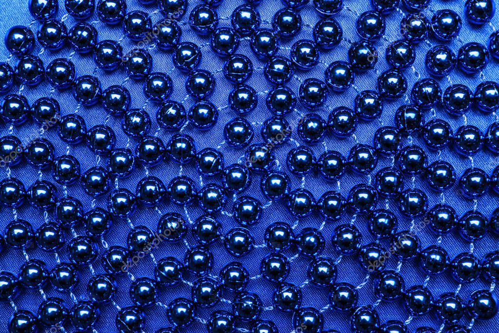 Muchas perlas azules sobre fondo de color 2025