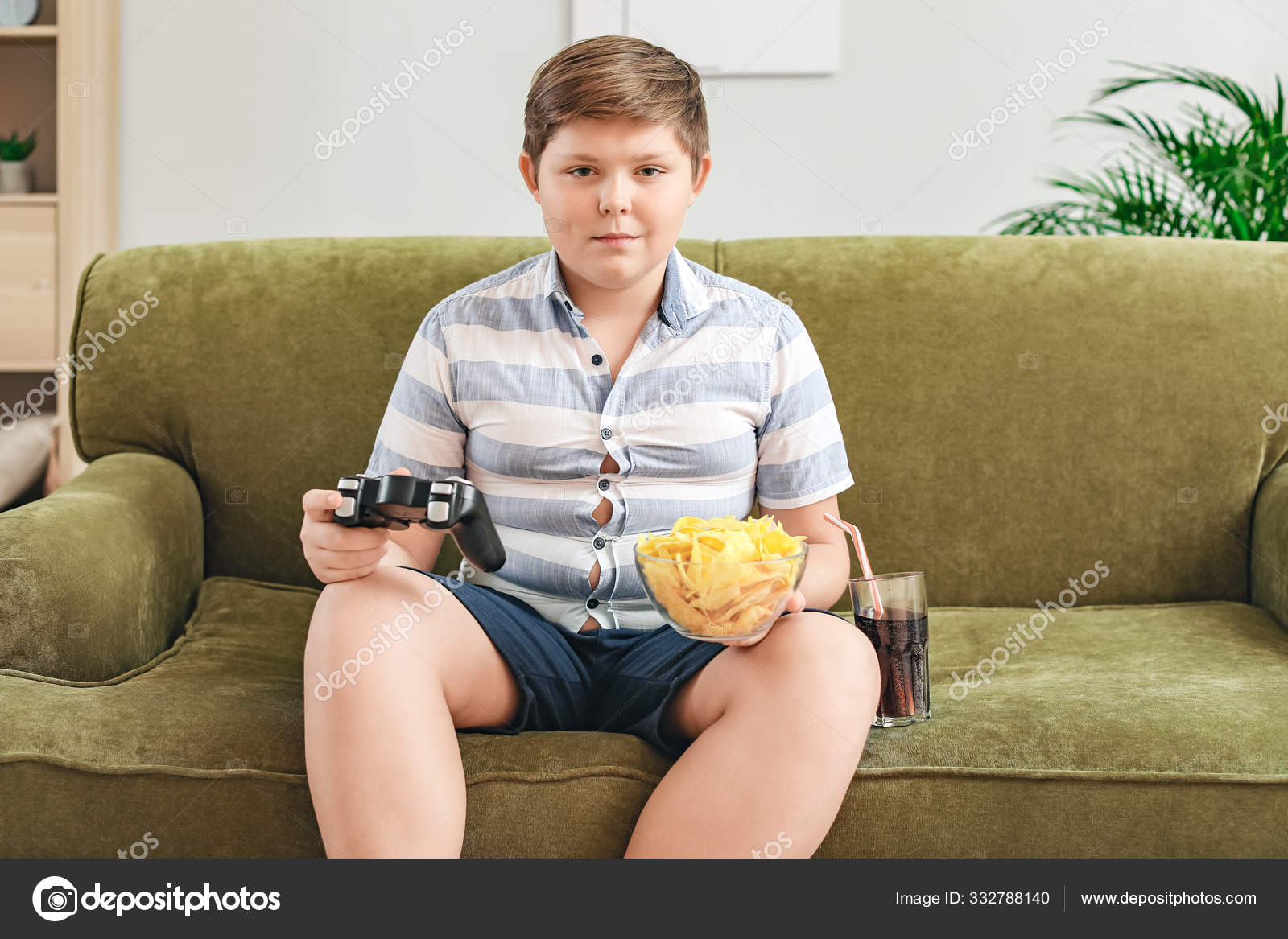 Overweight boy with chips playing video game at home — Stock Photo ...