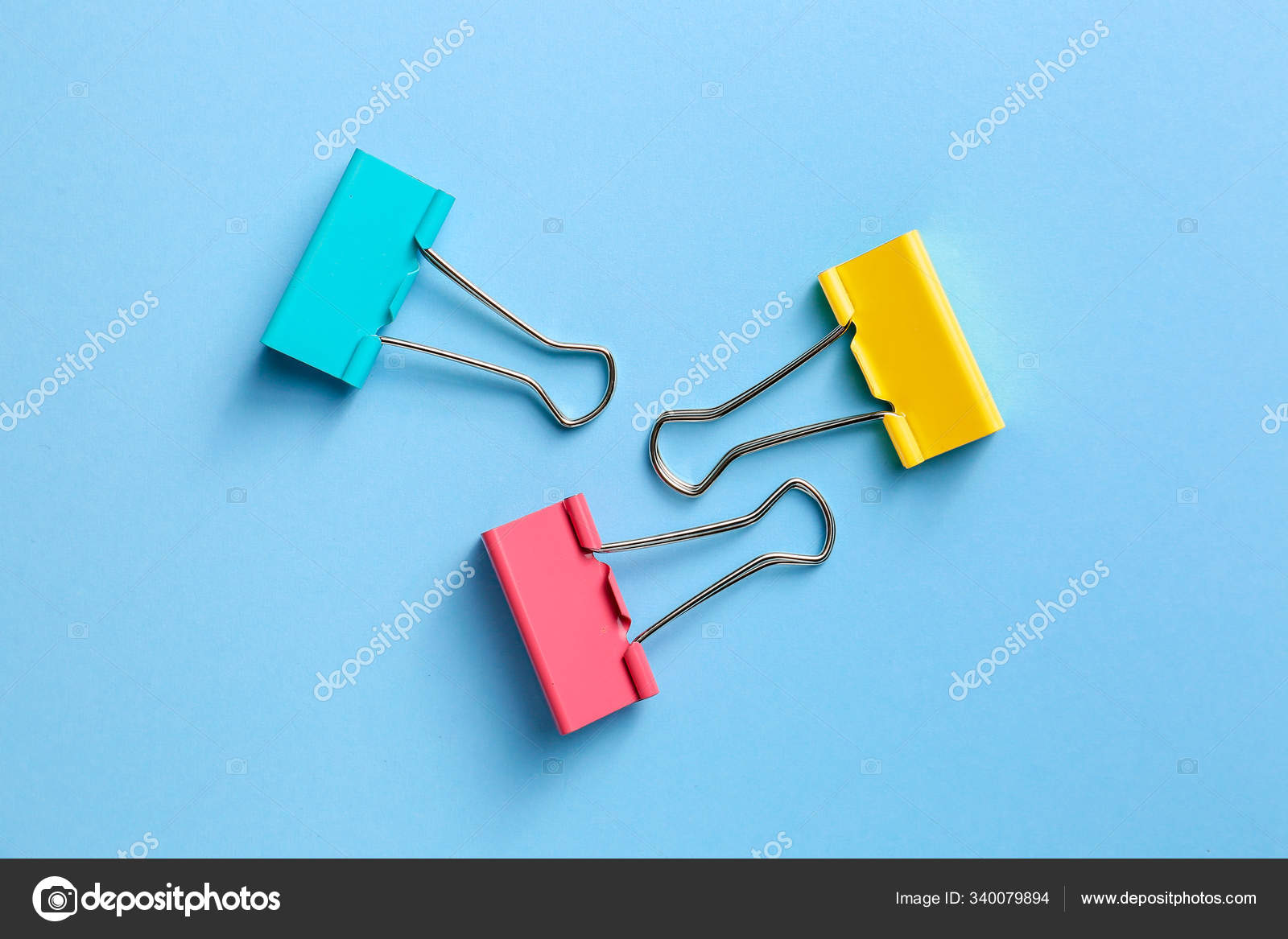 Binder clips for paper on color background Stock Photo by ©serezniy ...