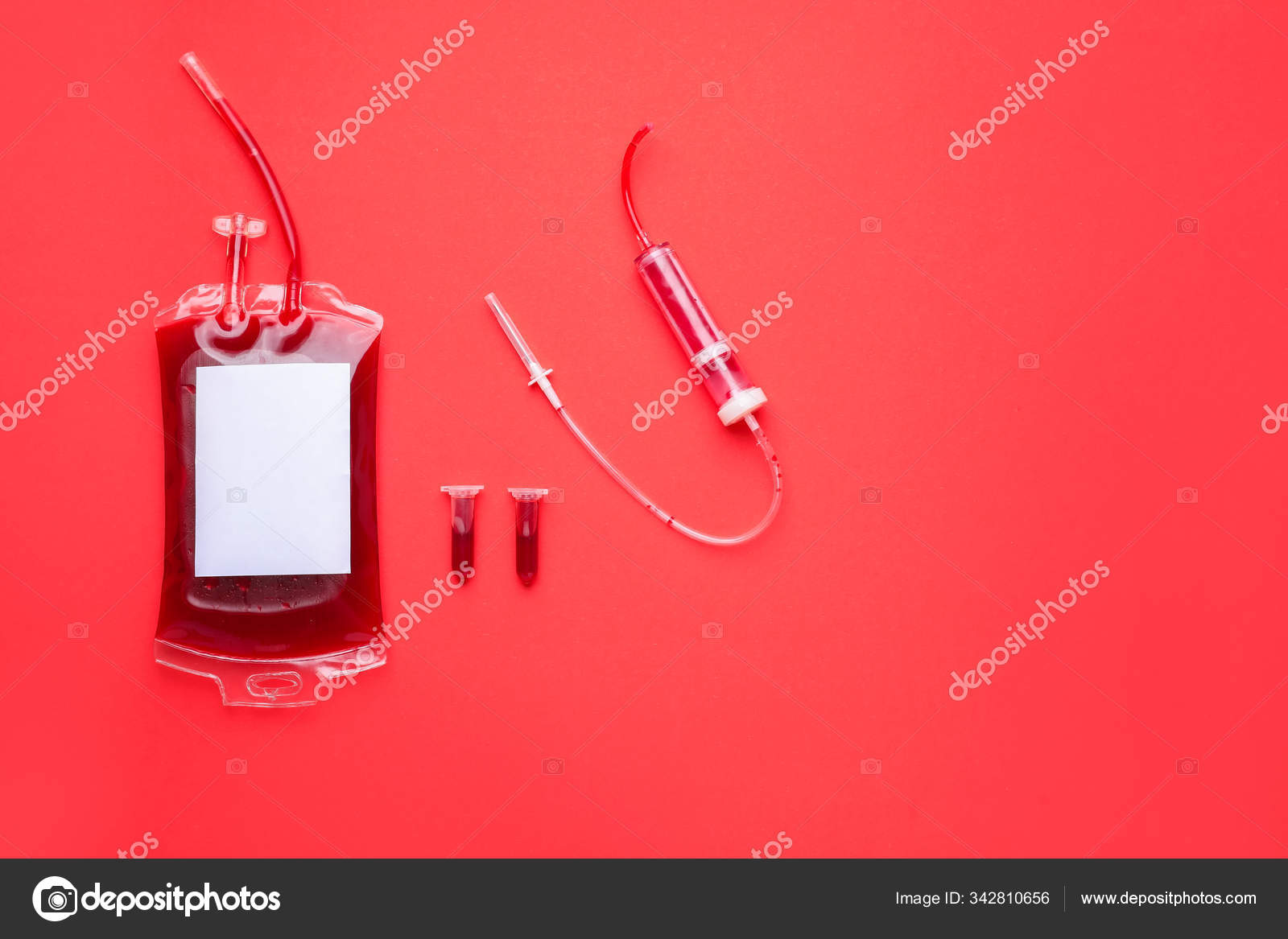 Blood pack for transfusion, test tubes and catheter on color background ...