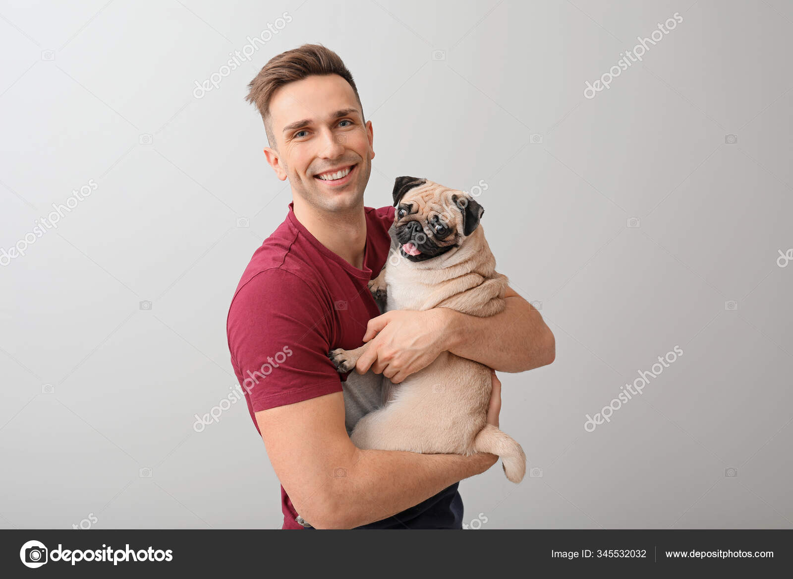 Handsome man with cute pug dog on light background Stock Photo by ...