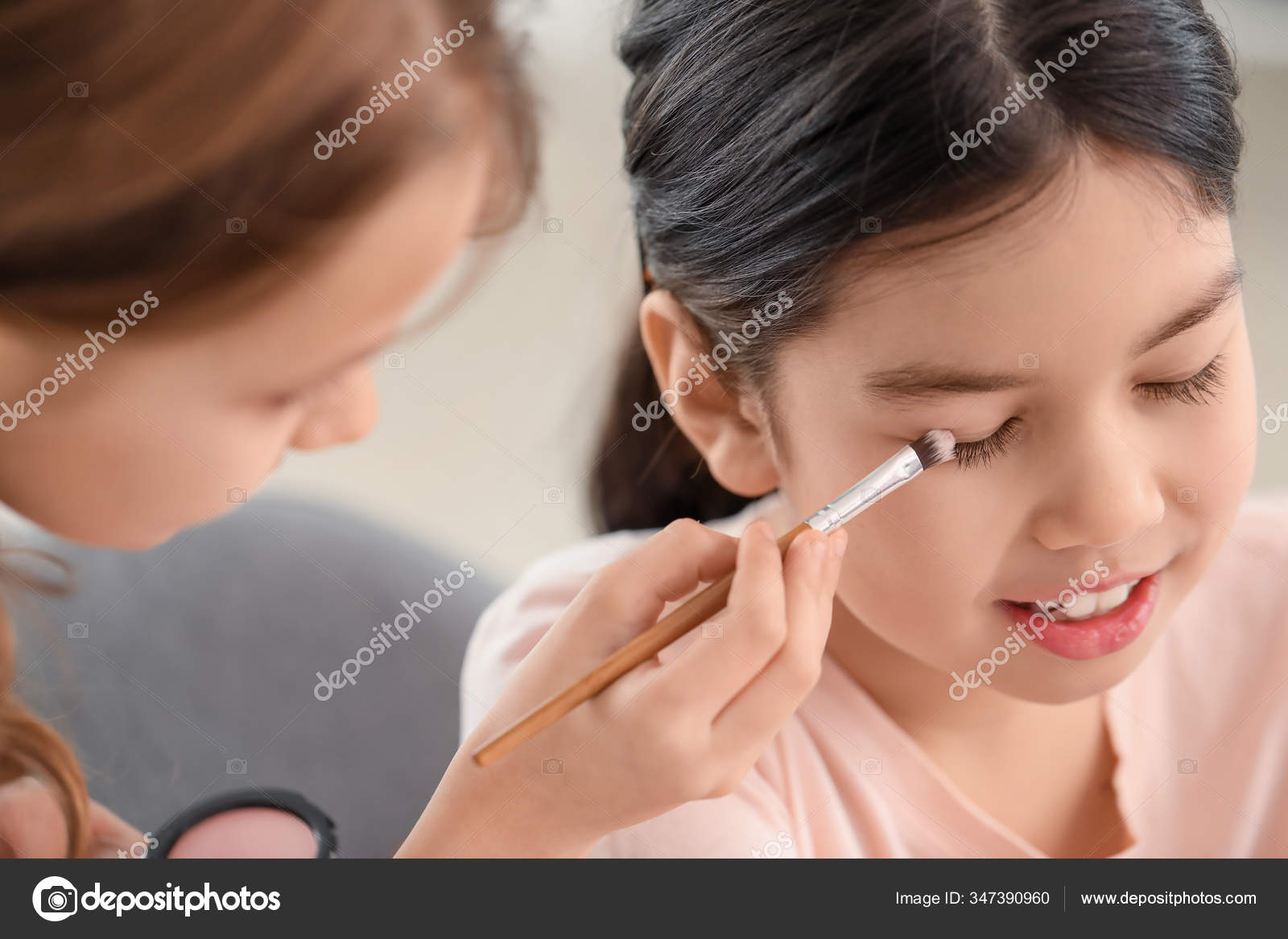 Cute Little Girl Applying Makeup Her Friend's Face Home Stock Photo by ...