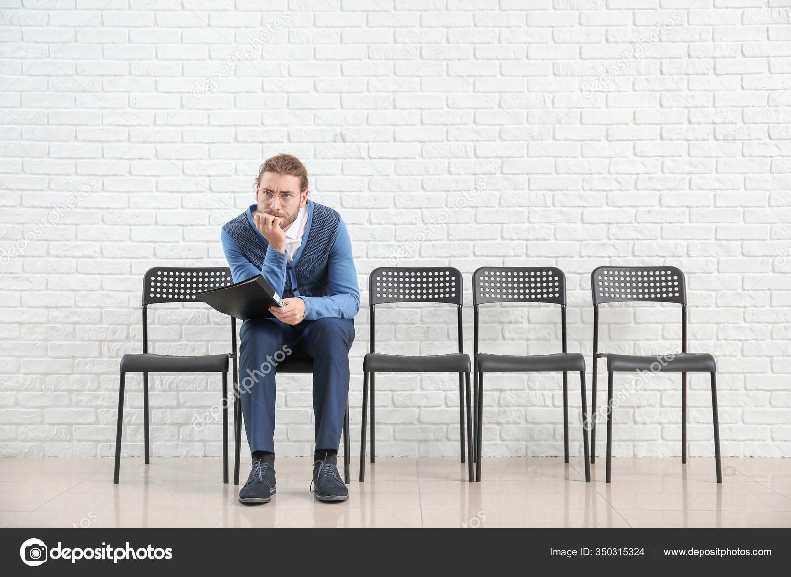 Young Man Waiting Job Interview Indoors Stock Photo by ©serezniy 350315324