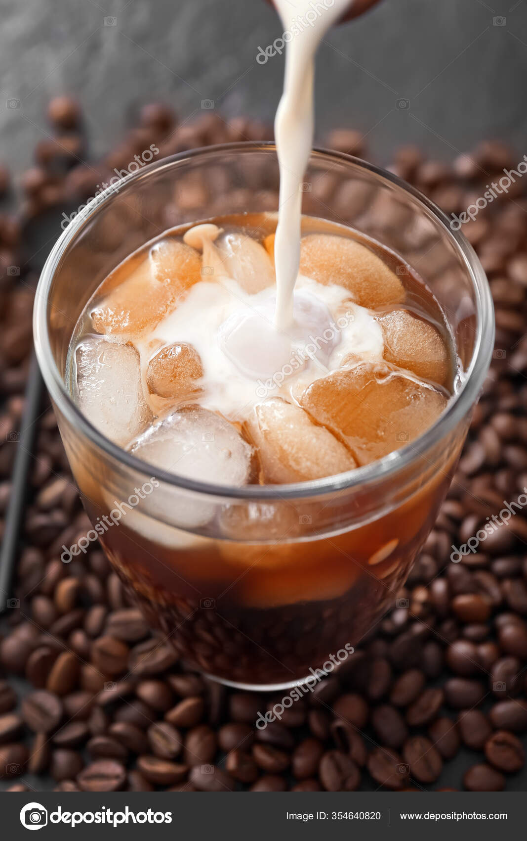 Pouring Milk Cold Coffee Glass Closeup Stock Photo by ©serezniy 354640820