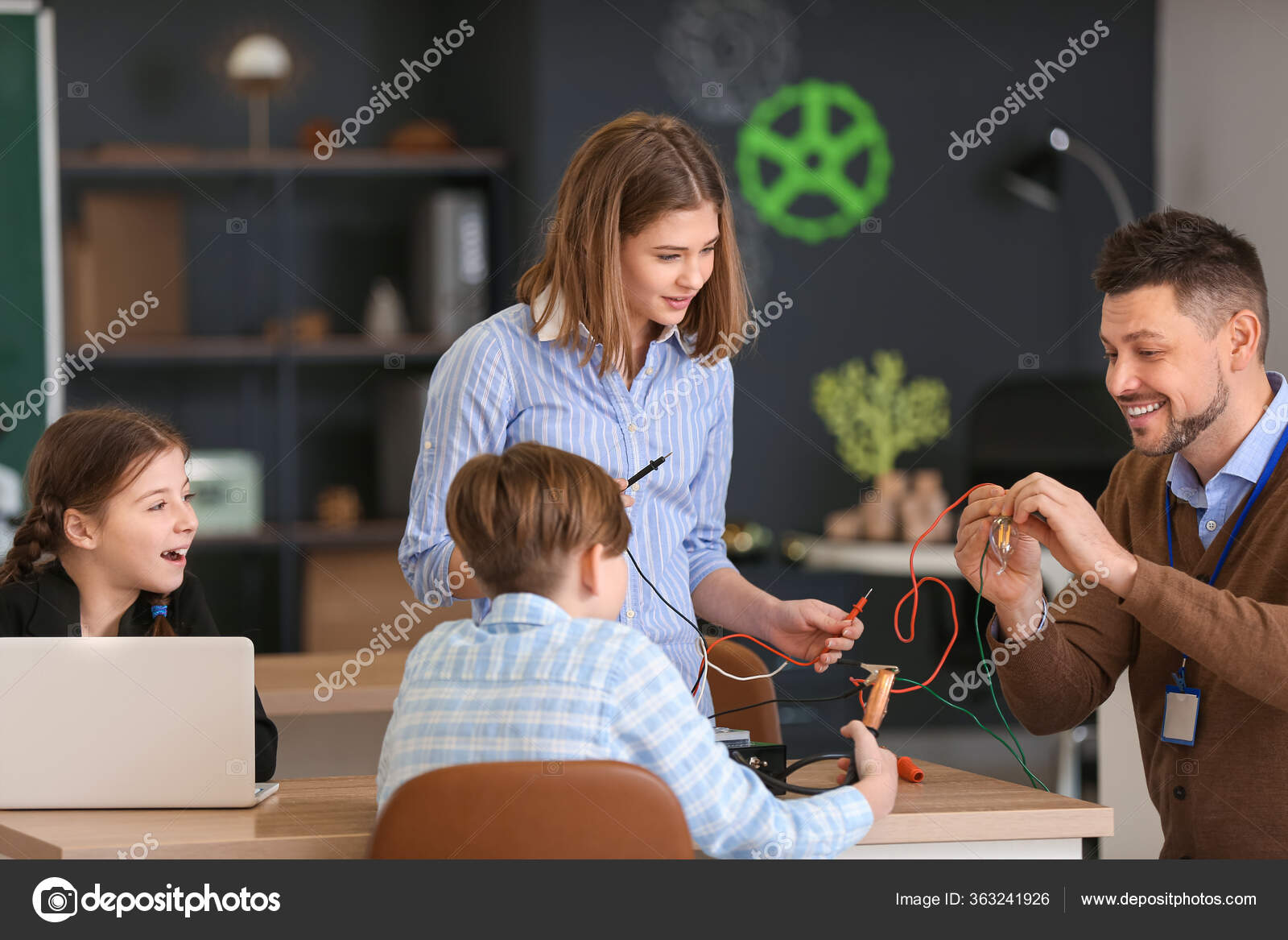 Teacher Conducting Physics Lesson Classroom Stock Photo by ©serezniy ...
