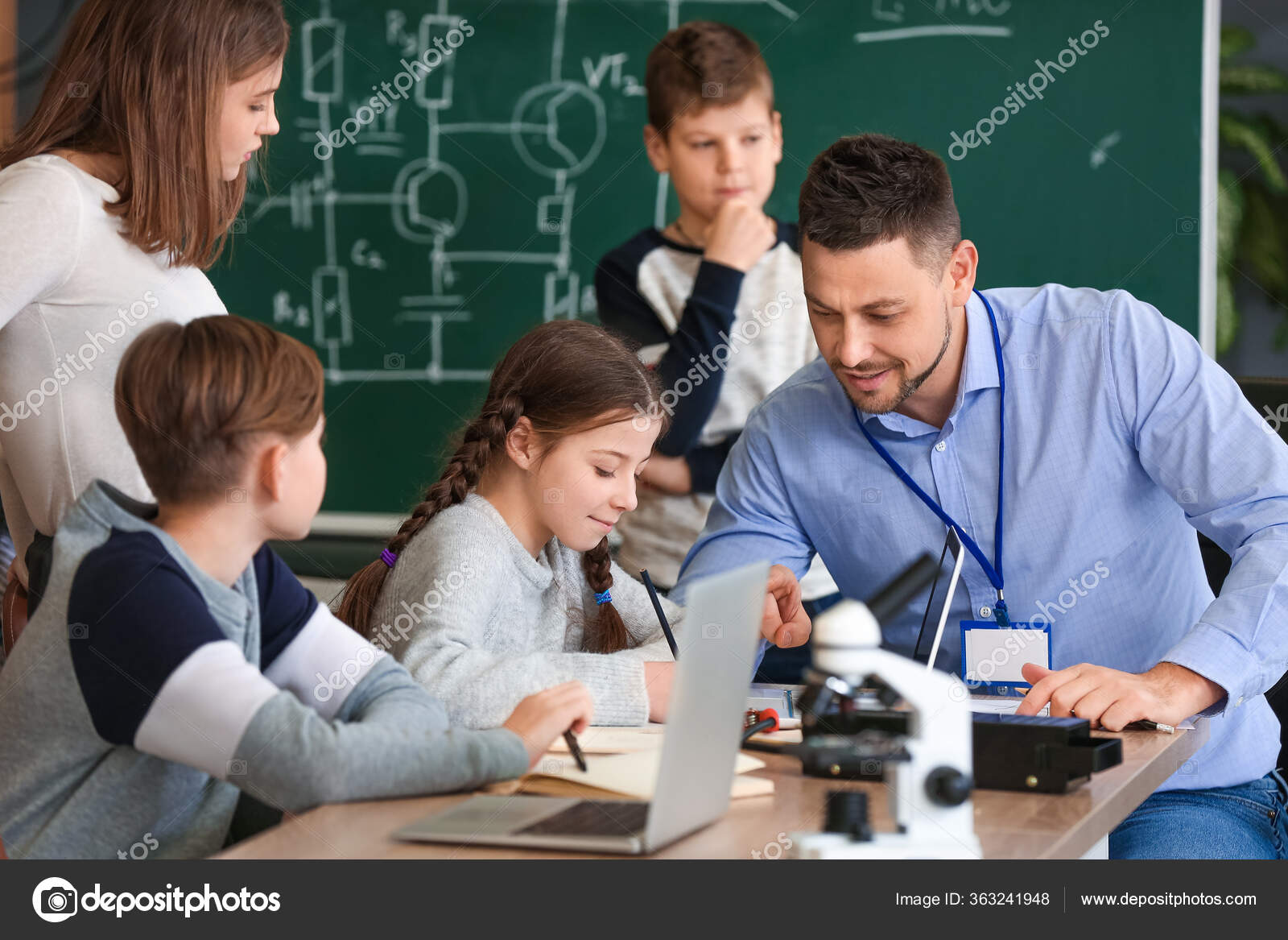 Teacher Conducting Physics Lesson Classroom Stock Photo by ©serezniy ...