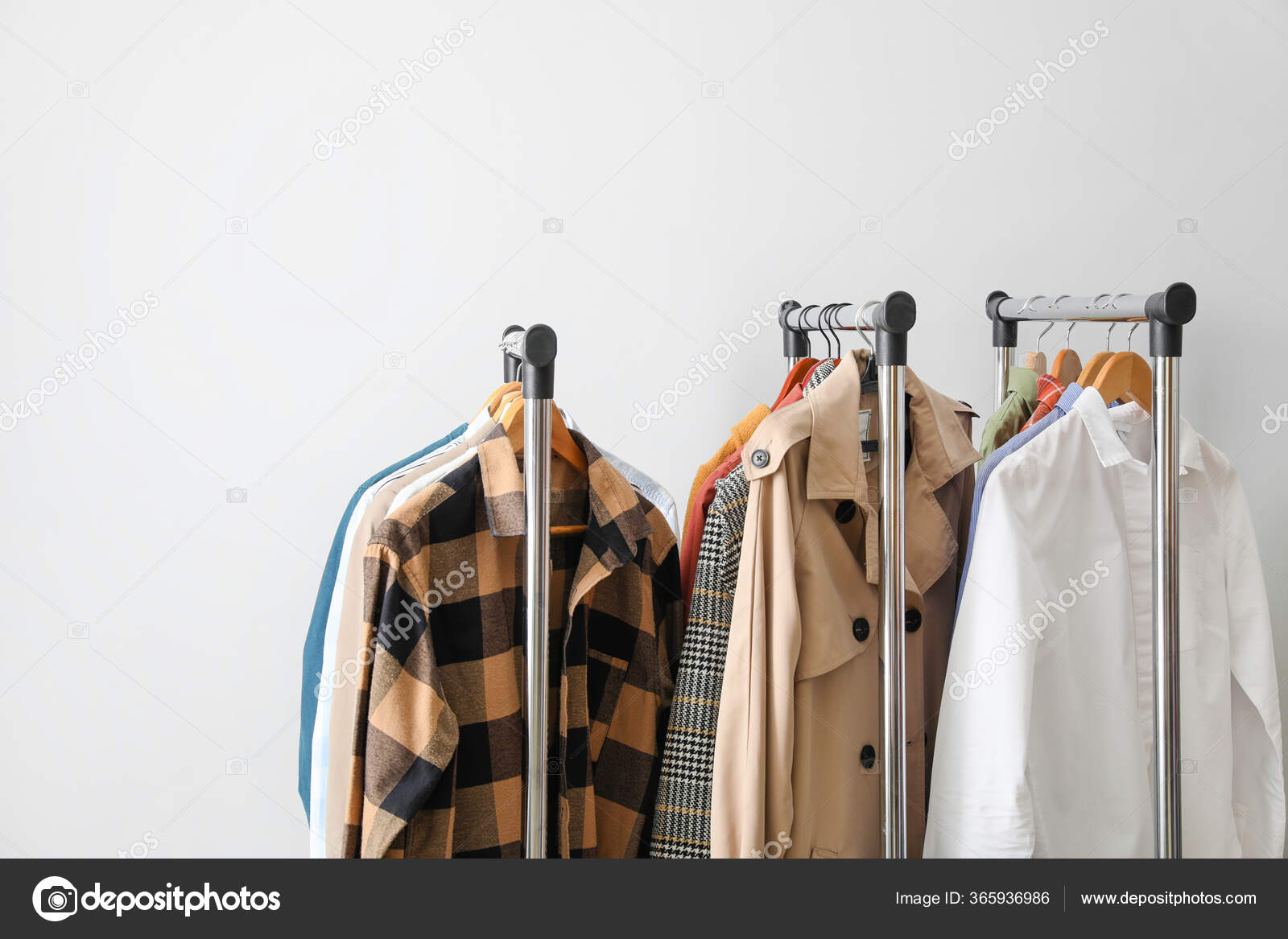 Rack Clothes Light Background Stock Photo by ©serezniy 365936986