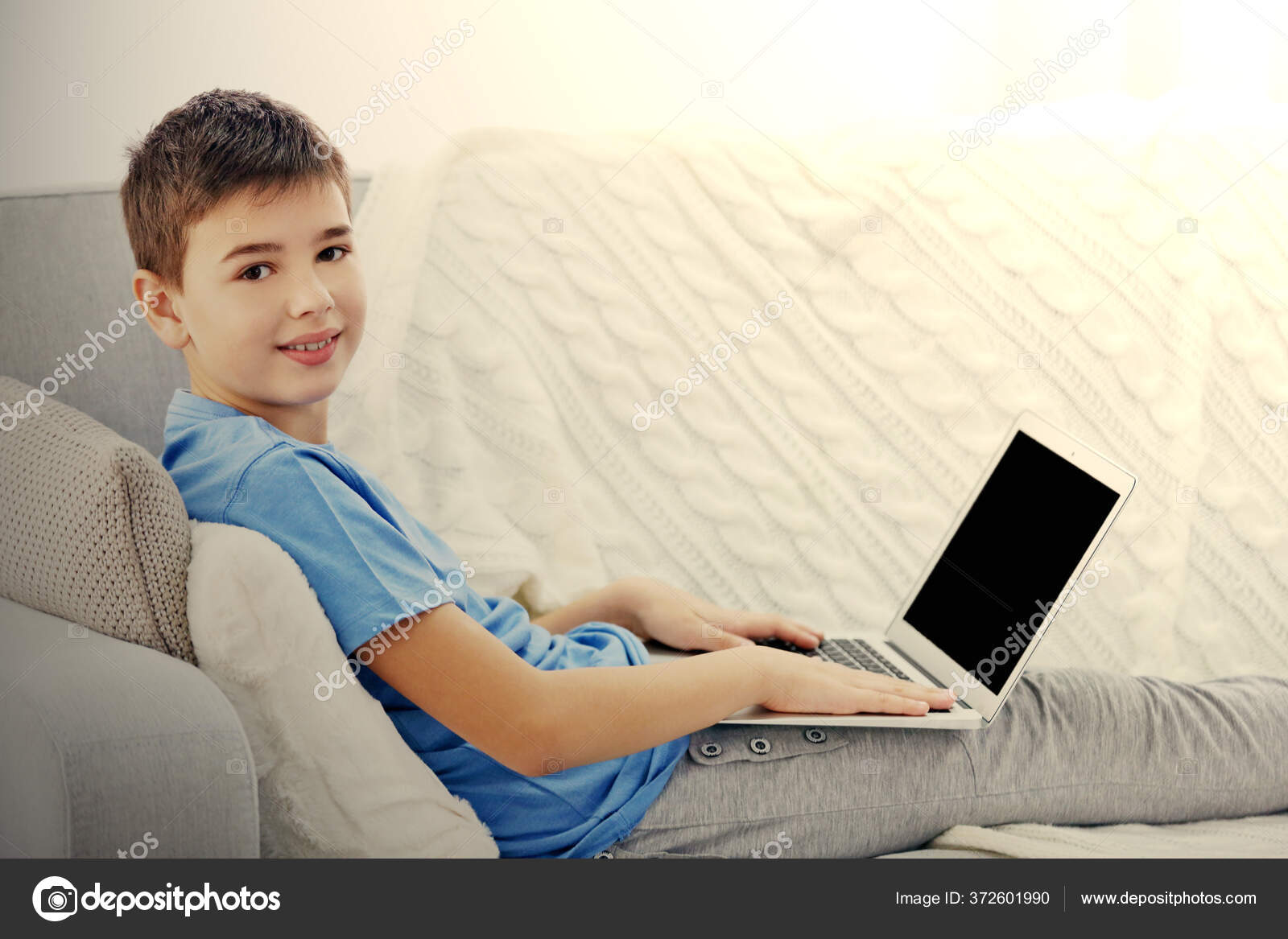 Boy Laptop Sitting Sofa Home — Stock Photo © serezniy #372601990