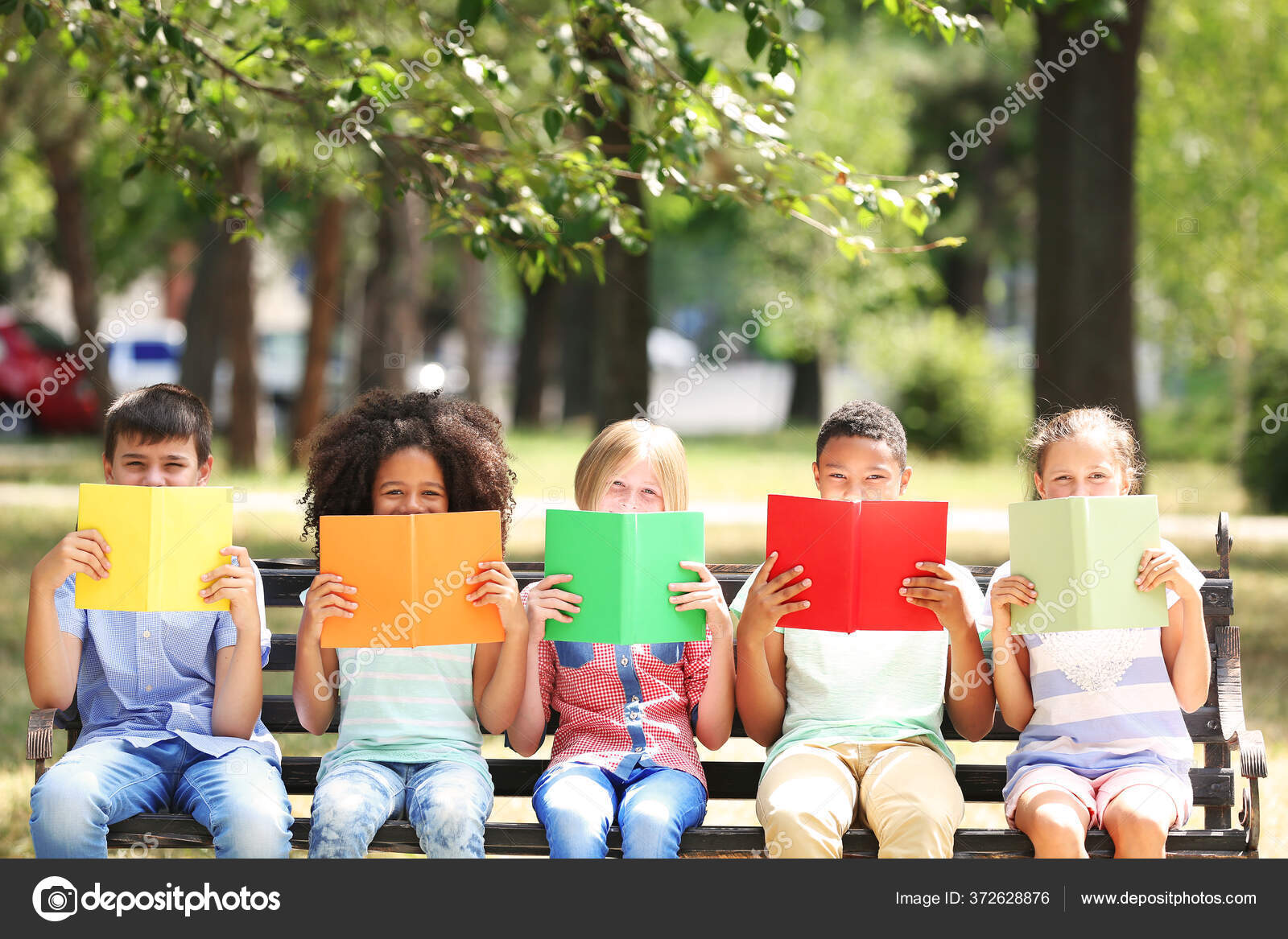 Cute Kids Reading Books Bench Stock Photo by ©serezniy 372628876