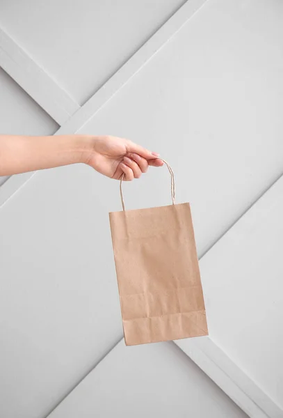 Hand Paper Bags Light Background Stock Photo by ©serezniy 375075552