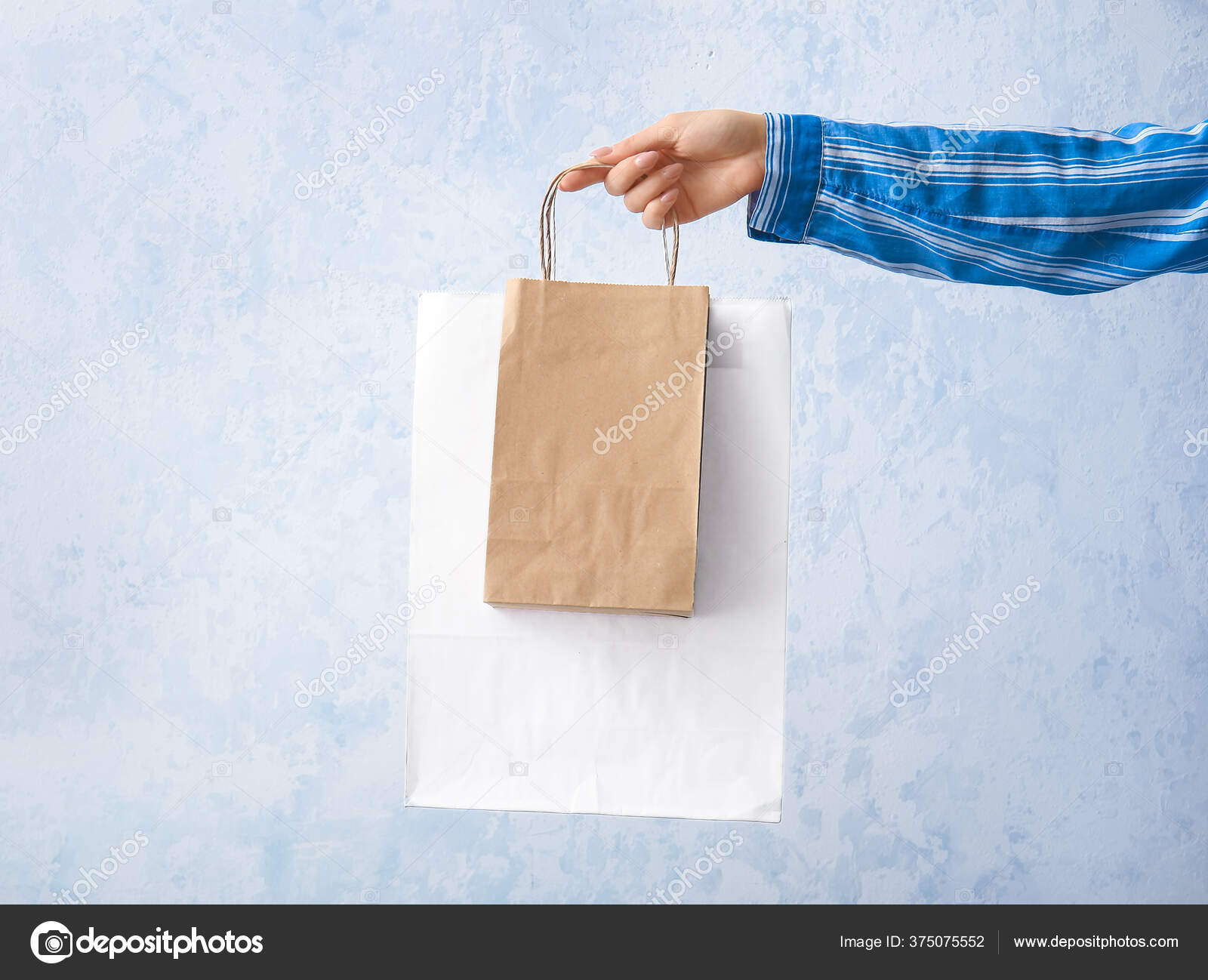 Hand Paper Bags Light Background Stock Photo by ©serezniy 375075552