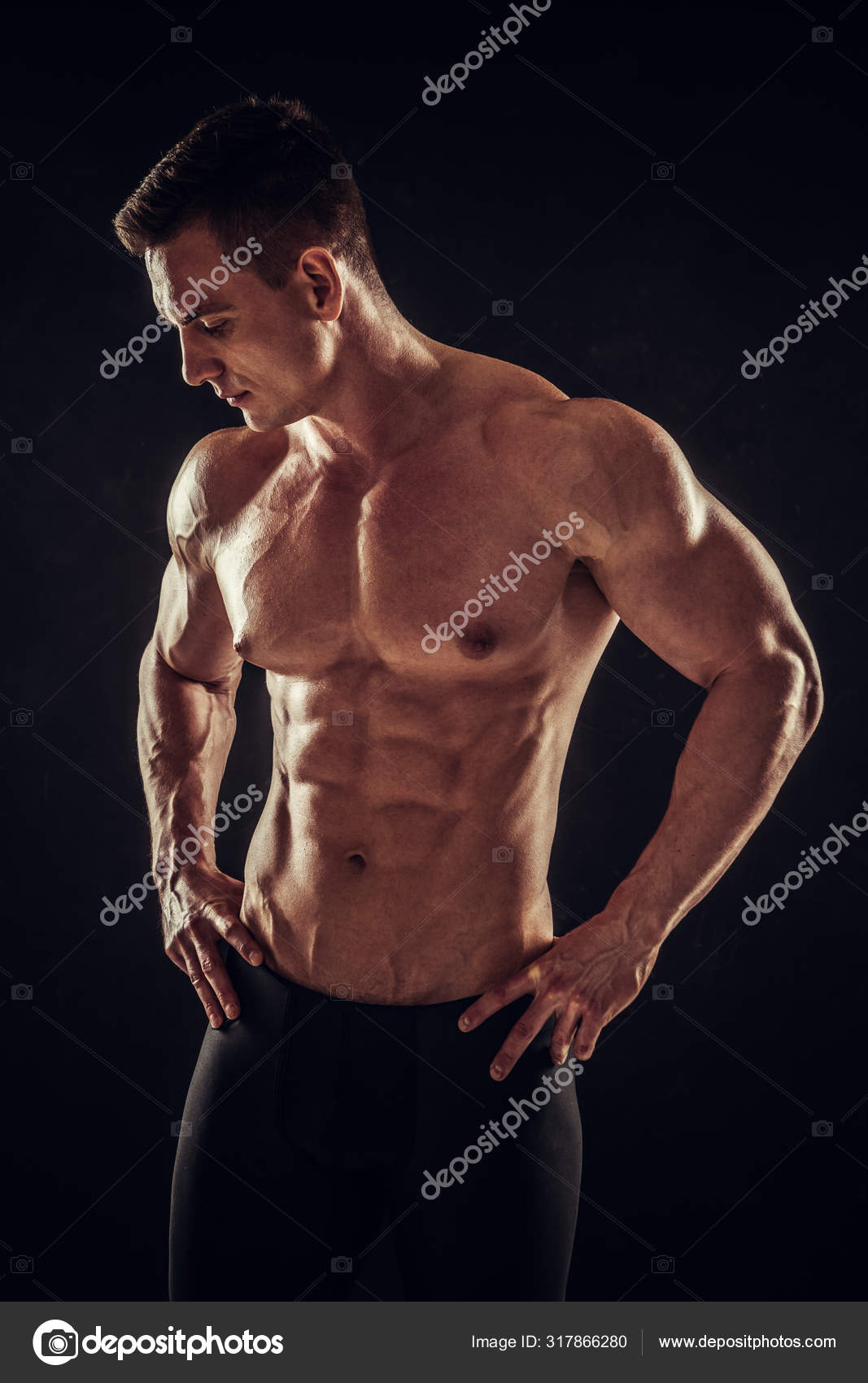 Athletic shirtless young male fitness model posing Stock Photo by ...