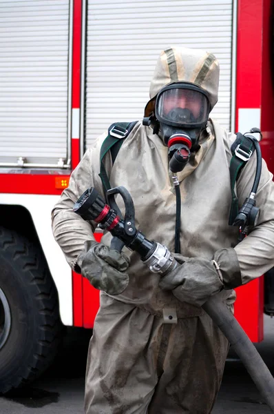 rescue team disinfecting street with special decontaminating liquid ...