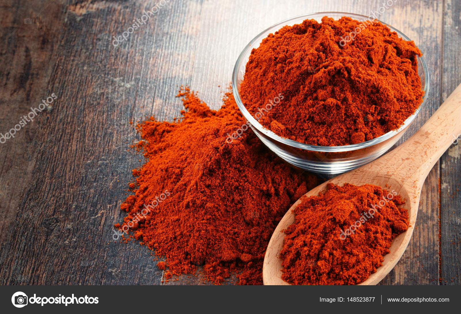 Composition with bowl of chili powder on wooden table Stock Photo by ...