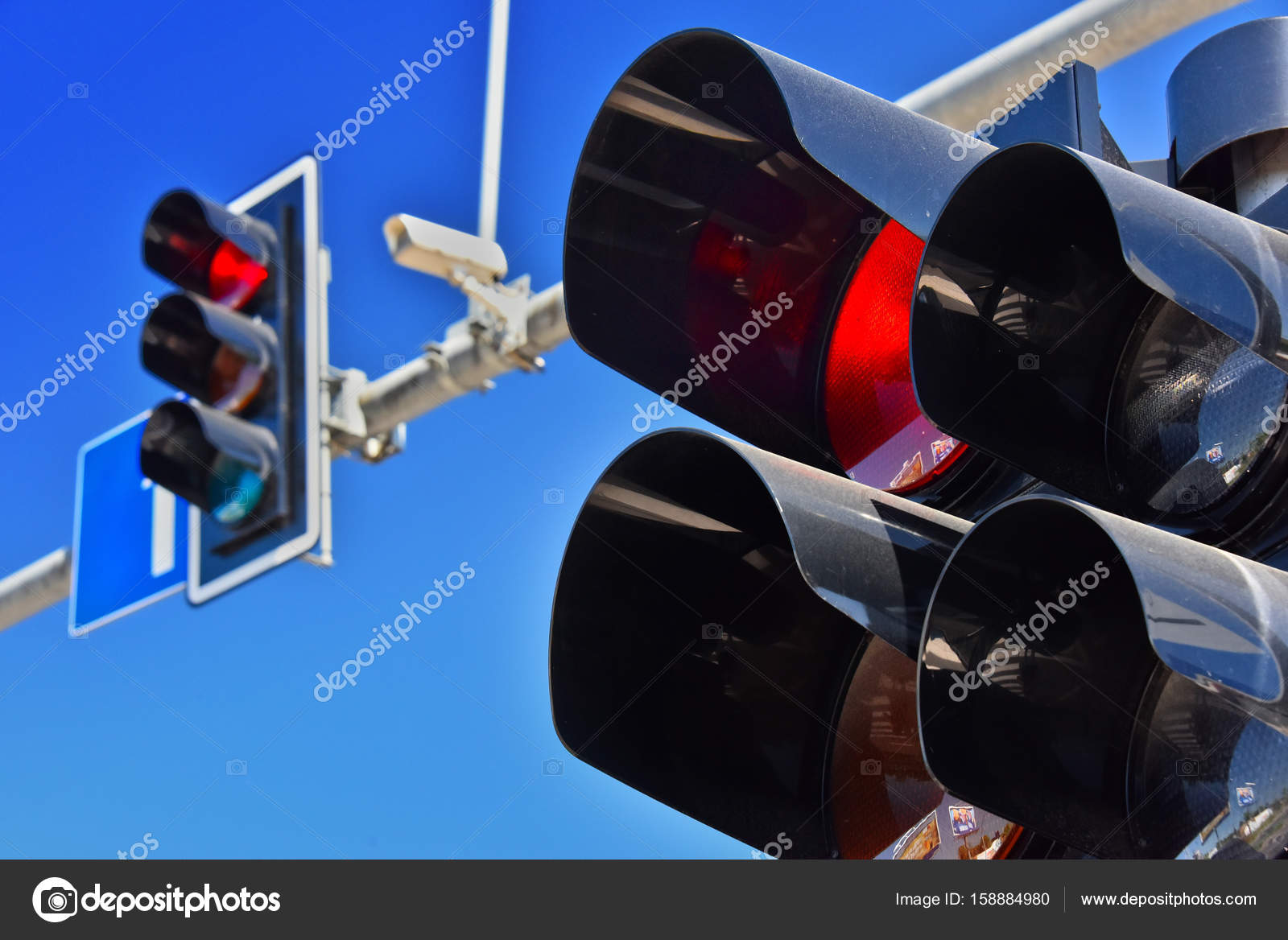 Traffic lights over blue sky Stock Photo by ©monticello 158884980