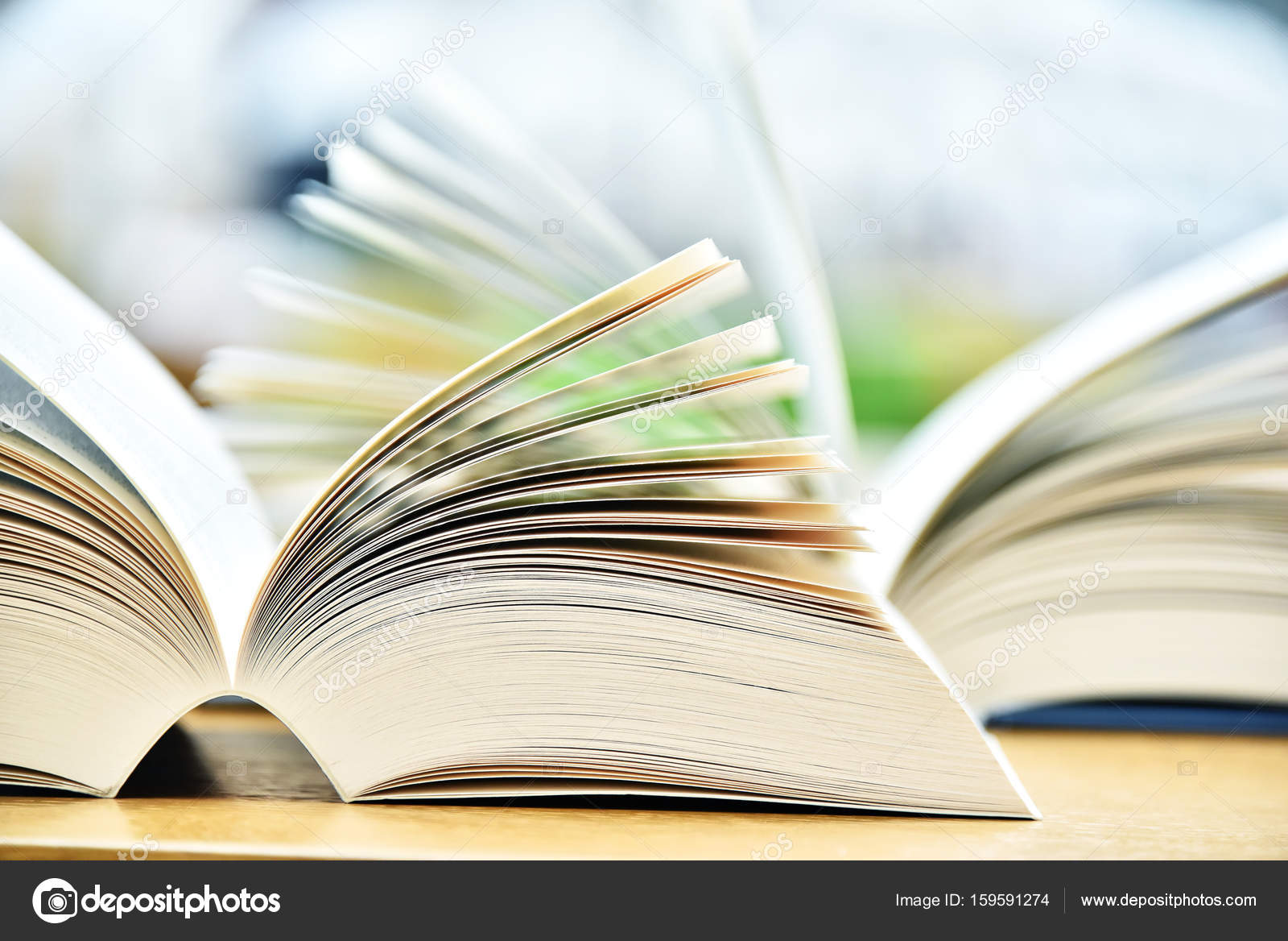 Books lying on the table in the public library Stock Photo by ...