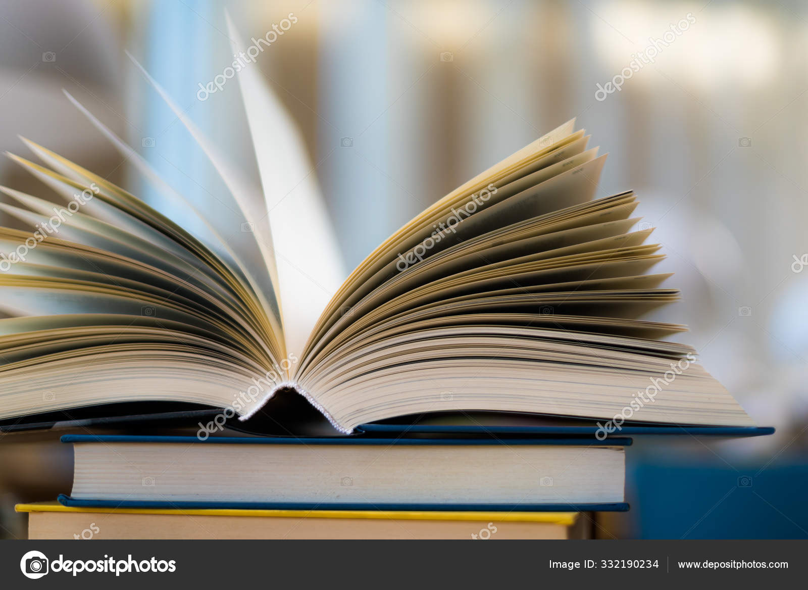 Open book lying on the table in the library — Stock Photo © monticello ...