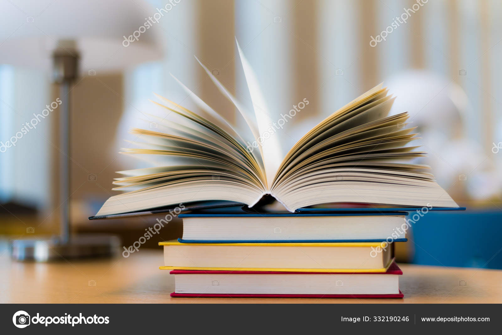 Open book lying on the table in the library — Stock Photo © monticello ...