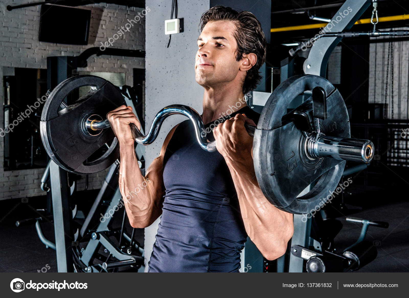 Man exercising in gym Stock Photo by ©DimaGavrish 137361832