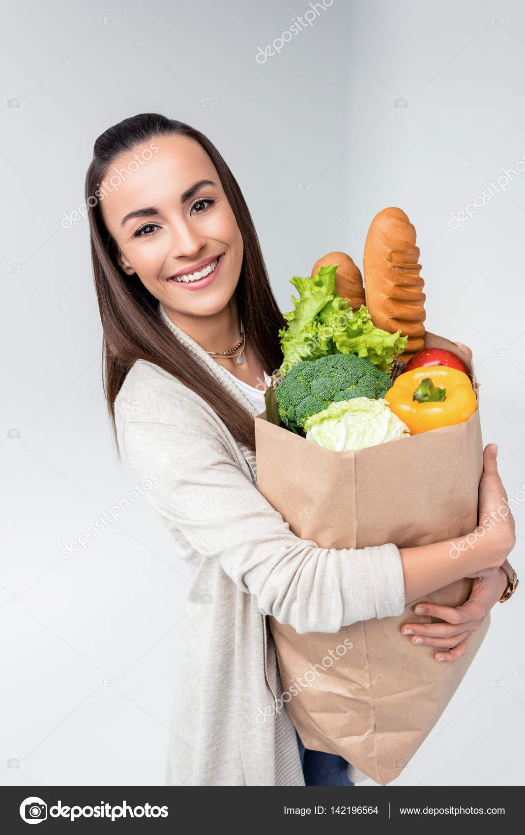 Woman holding grocery bag — Stock Photo © TarasMalyarevich #142196564 Woman holding grocery bag — Stock Photo © TarasMalyarevich #142196564