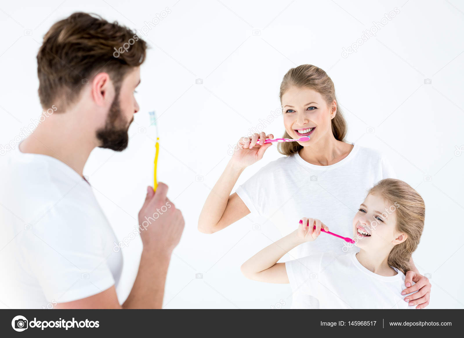 Family holding toothbrushes — Stock Photo © TarasMalyarevich #145968517