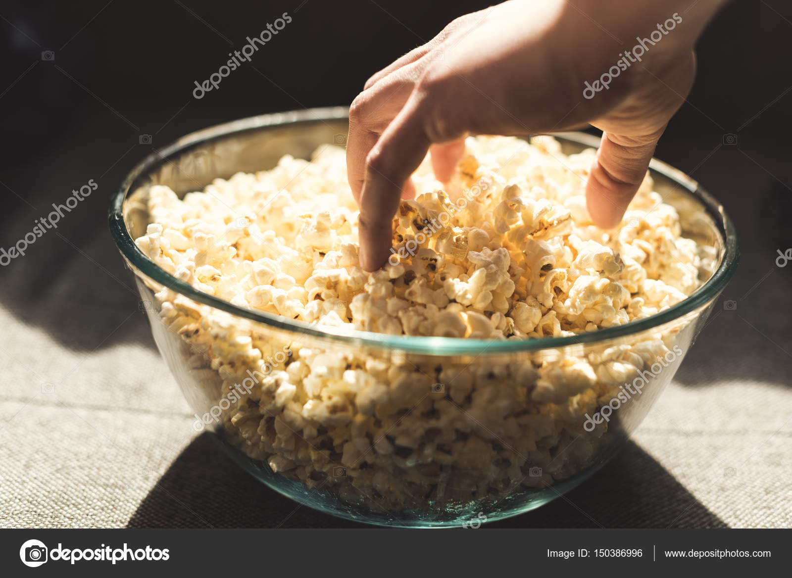 Human hand taking popcorn — Free Stock Photo © TarasMalyarevich #150386996