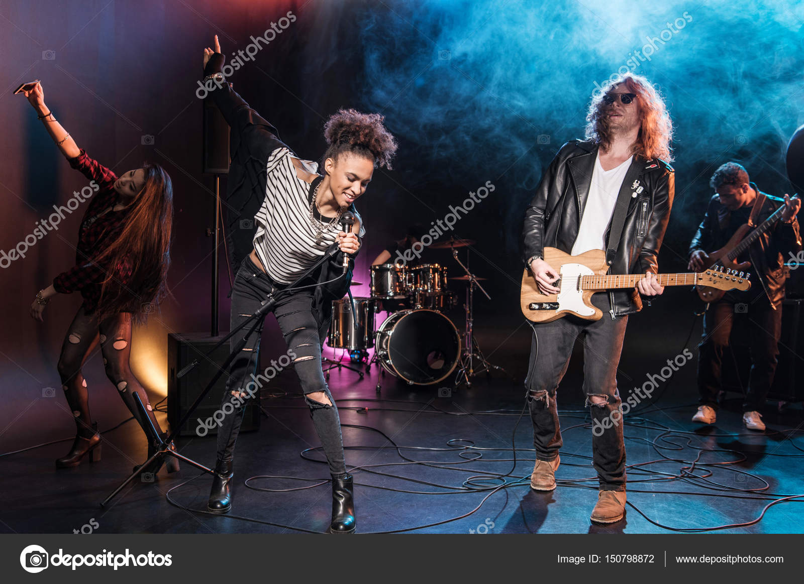 Rock band on stage — Stock Photo © TarasMalyarevich #150798872