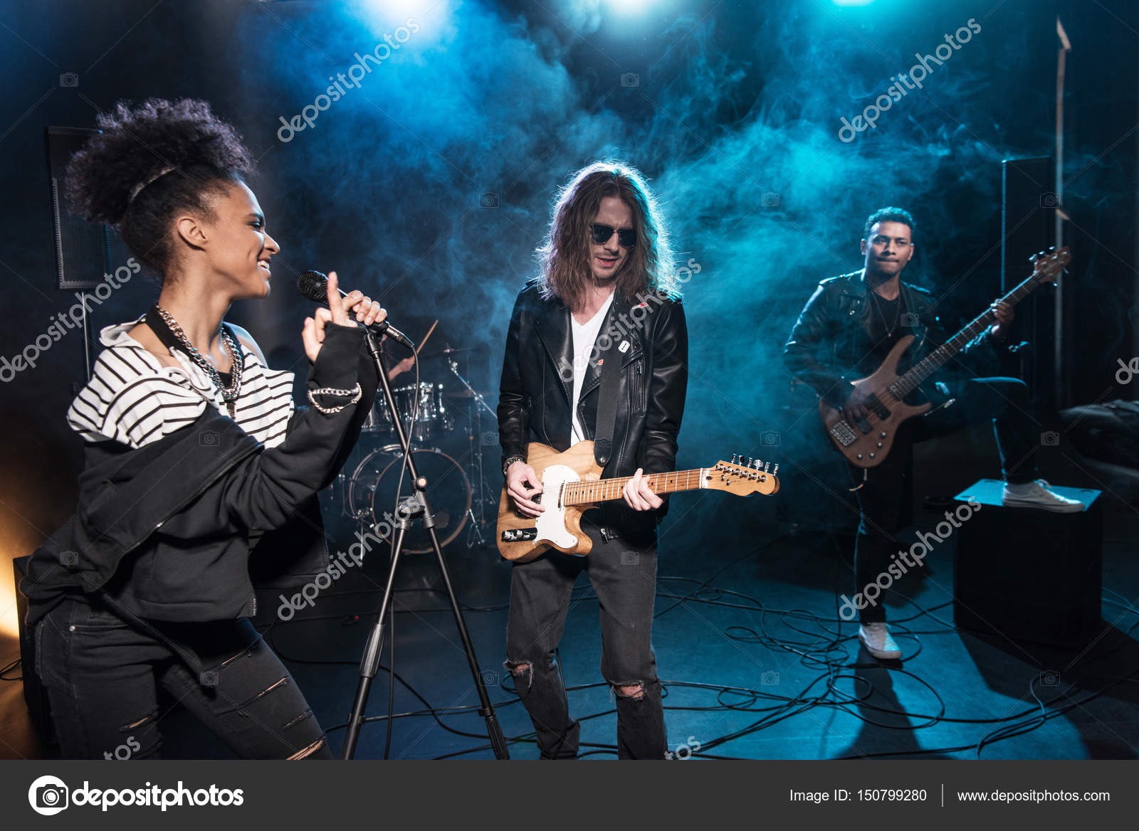 Rock band on stage — Stock Photo © TarasMalyarevich #150799280