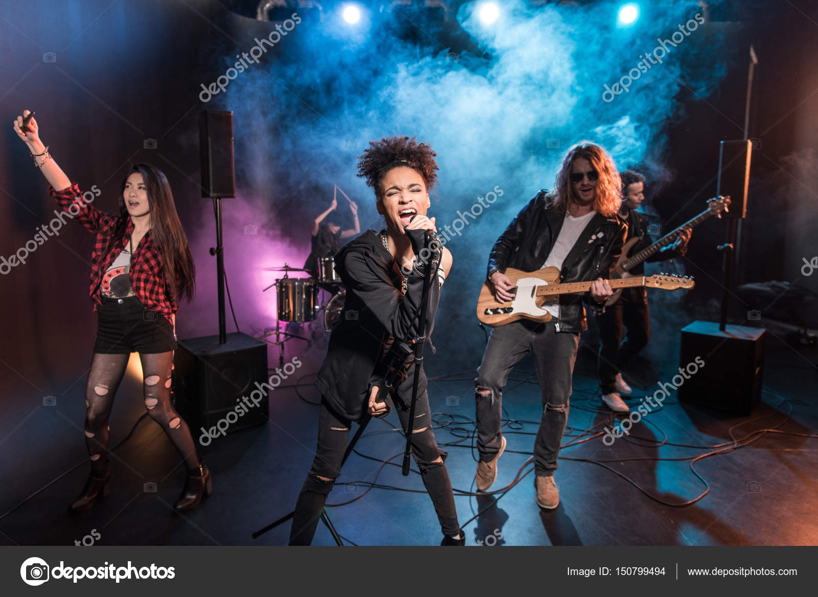 Rock band on stage — Stock Photo © TarasMalyarevich #150799494