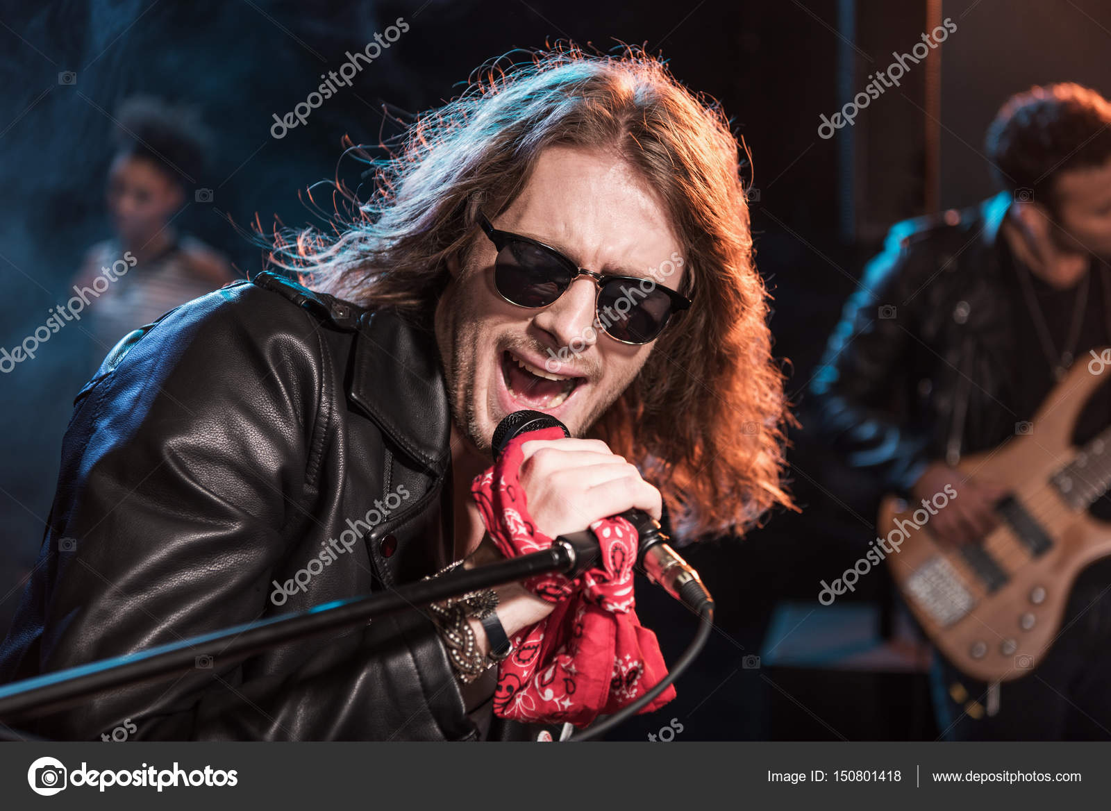 Rock band on stage — Stock Photo © TarasMalyarevich #150801418