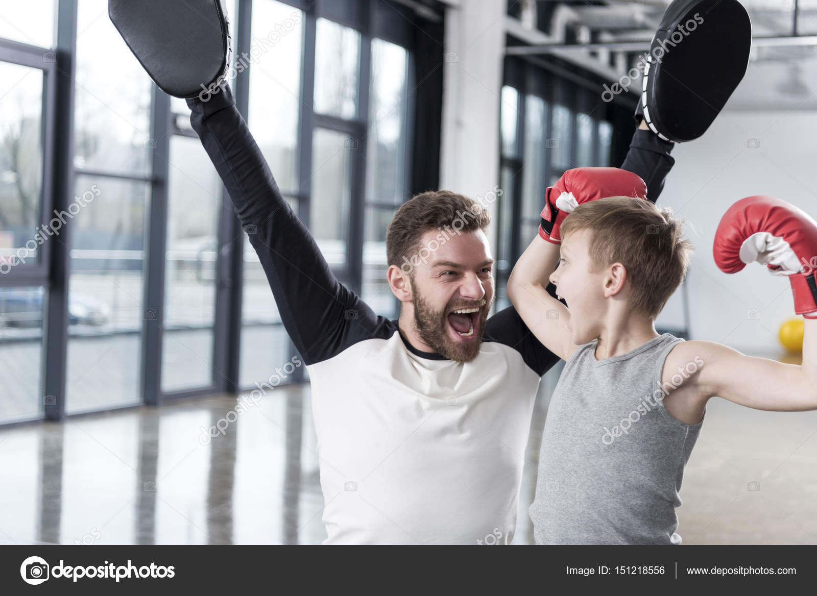 Boy boxer with his coach — Stock Photo © TarasMalyarevich #151218556