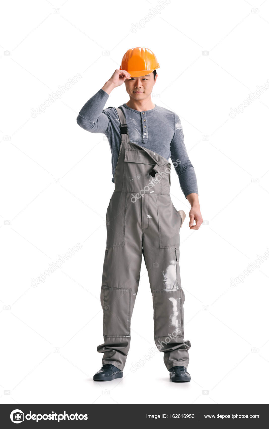 Construction worker in overall and helmet Stock Photo by ...