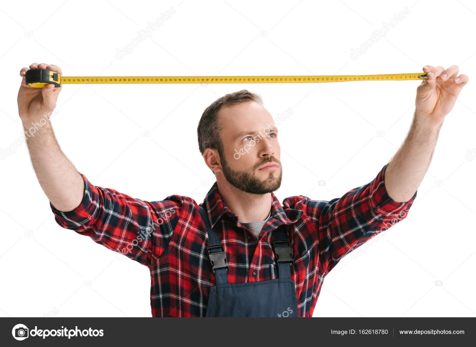 Construction worker with measuring tape Stock Photo by ...