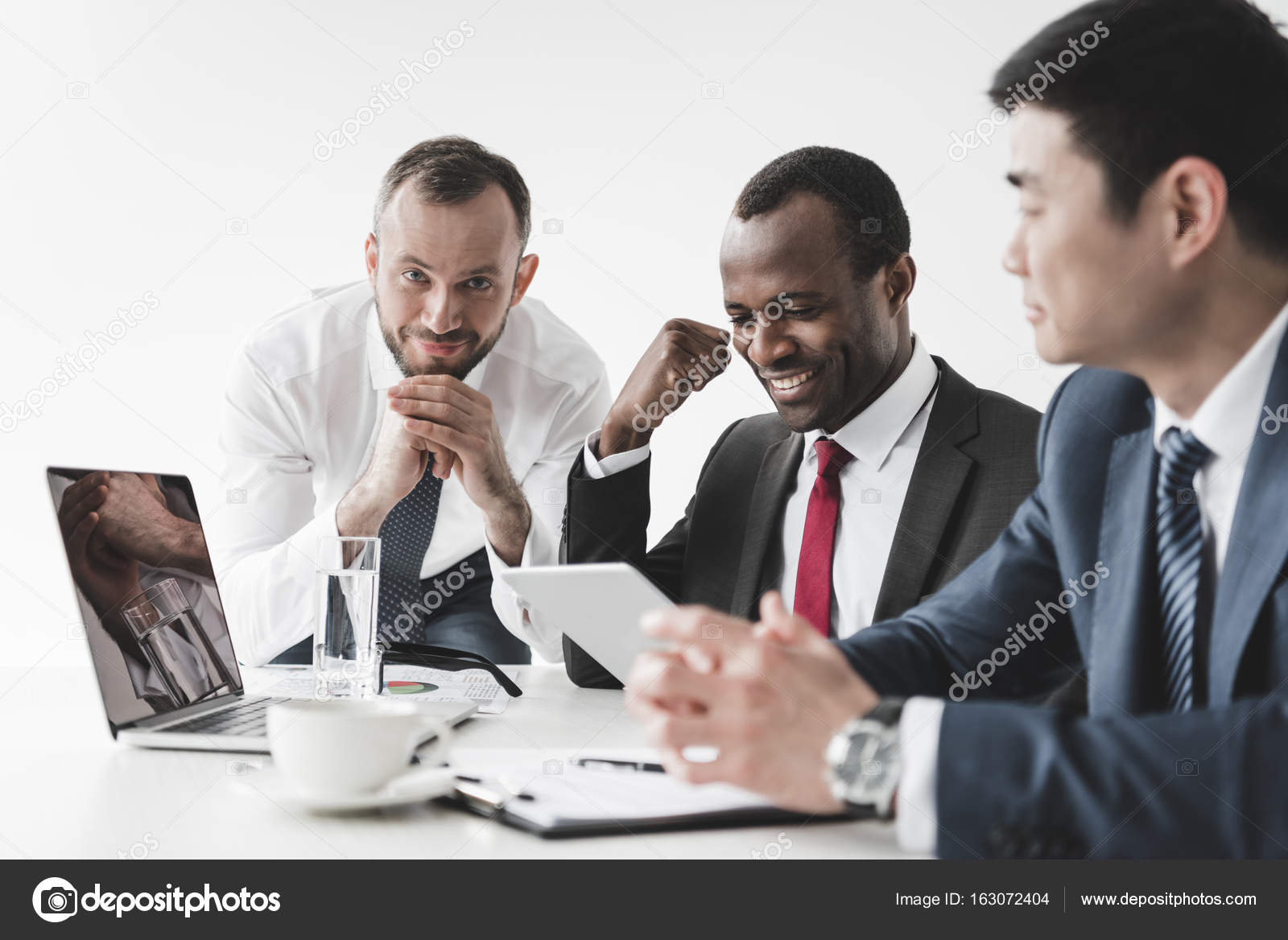 Multiethnic businessmen having discussion — Stock Photo ...